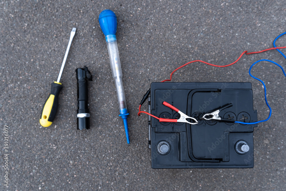 Top view of the battery and tools for diagnosing and repairing the ...