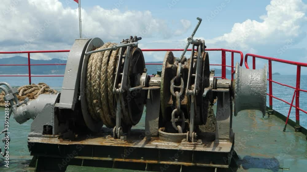Old cargo ferry equipment with sea wave background in tropical area ...