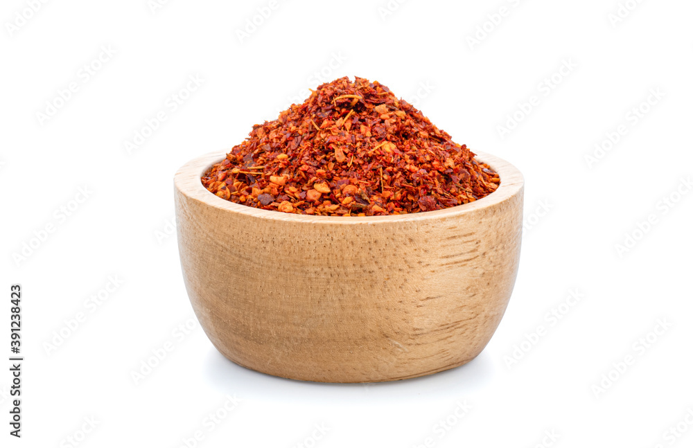 pile crushed red cayenne pepper, dried chili flakes and seeds on white ...