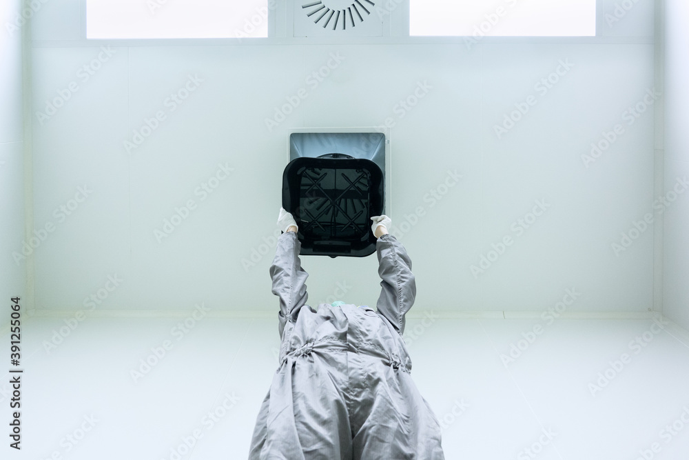 The unidentified operator is using the capture hood balometer to ...