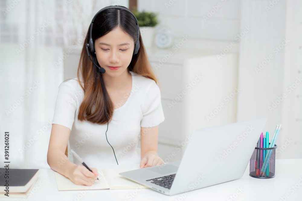 Young asian woman wearing headphone study online with e-learning on ...