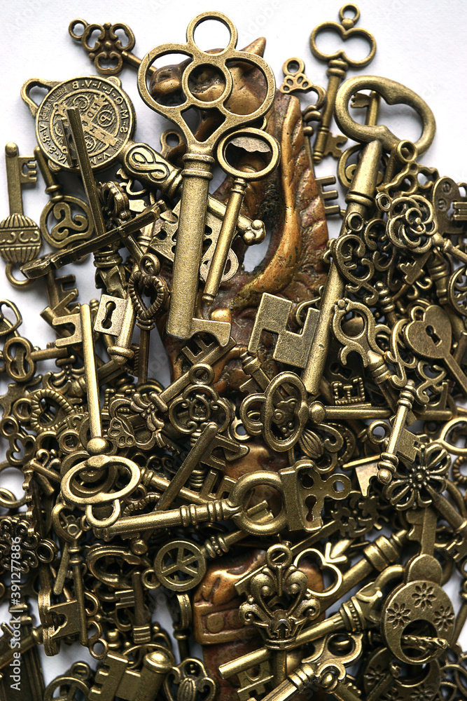 Key shapes surrounding old paper knife Stock Photo | Adobe Stock