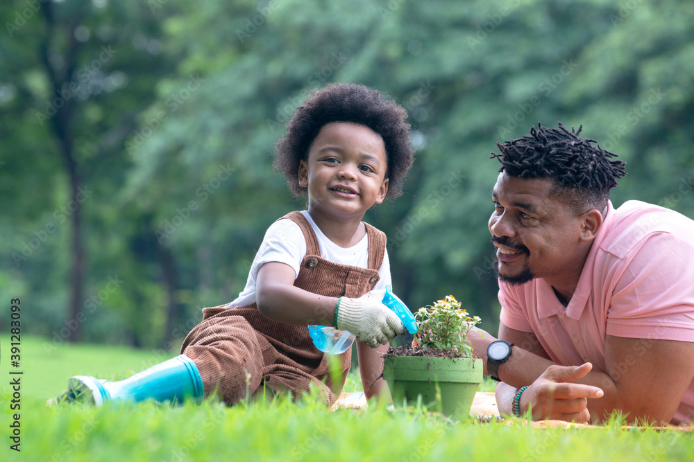 Dark-skinned boy and his father spent time outdoors on summer days, boy ...