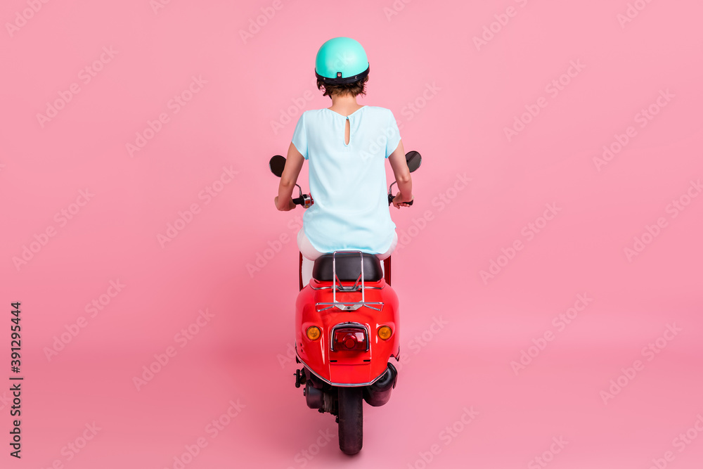 Rear behind view photo of nice pretty girl sitting on moped driving ...