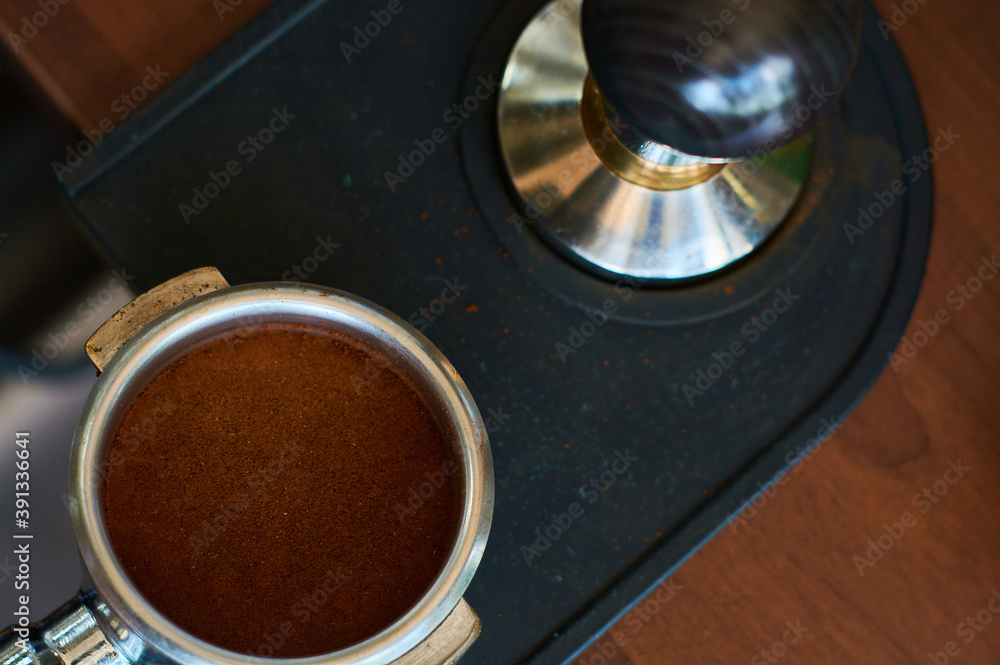 The process of temper coffee in holder, making espresso on coffee ...