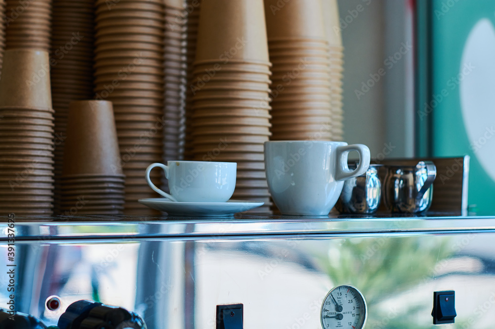 Professional coffee machine in coffee shop with empty craft disposable ...