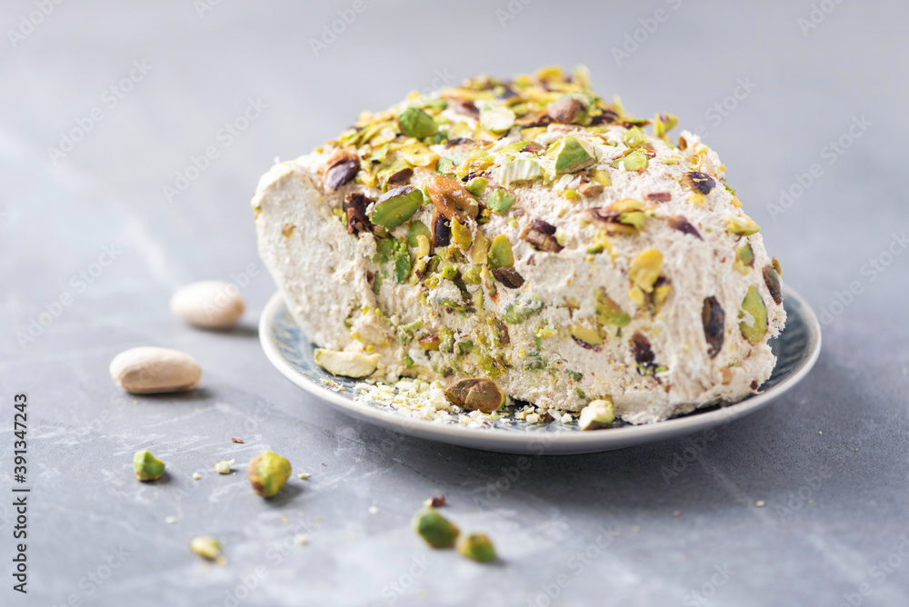 Sesame halva with pistachios on grey background. Top view. Copy space ...