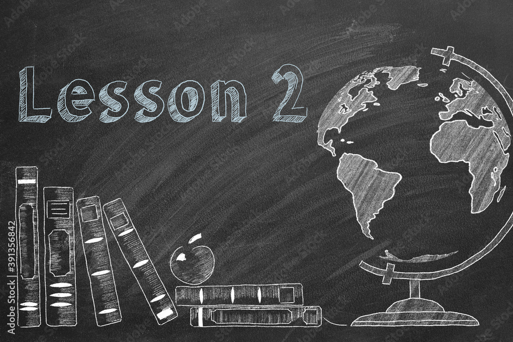 Lettering "Lesson 2", globe and school books are drawn with chalk on a ...