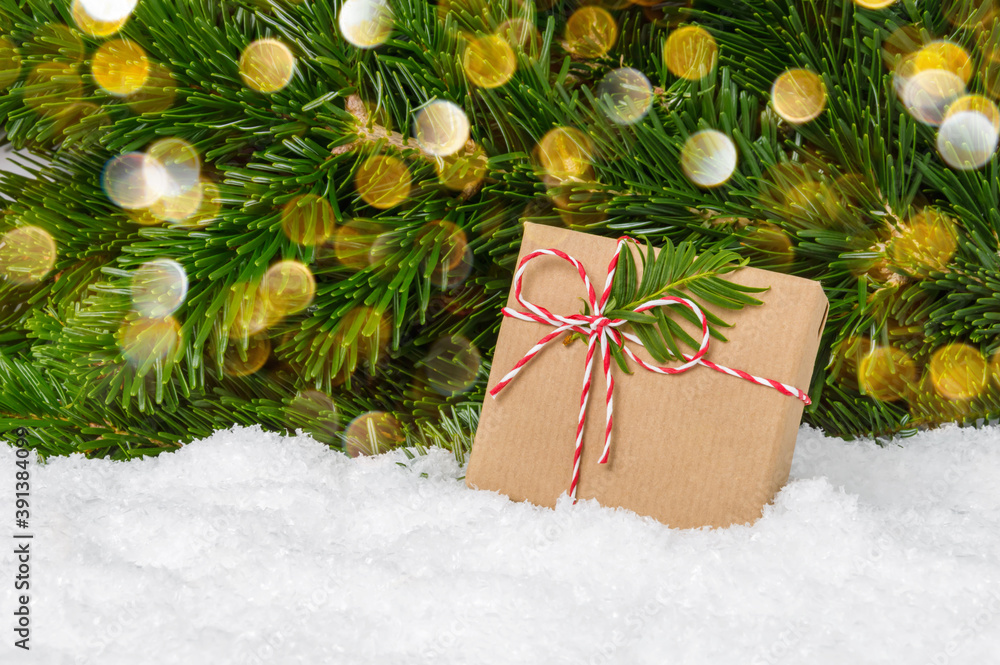 Handmade plastic-free Christmas present under fir tree. Gift box ...