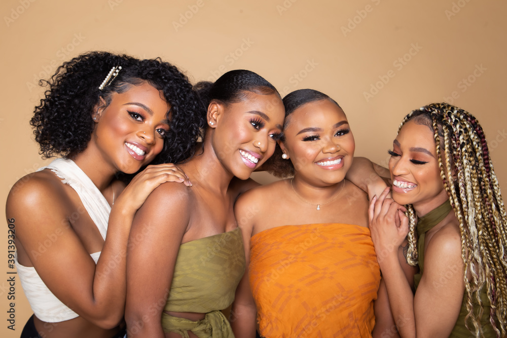 Studio portrait of four beautiful black female friends Stock Photo ...
