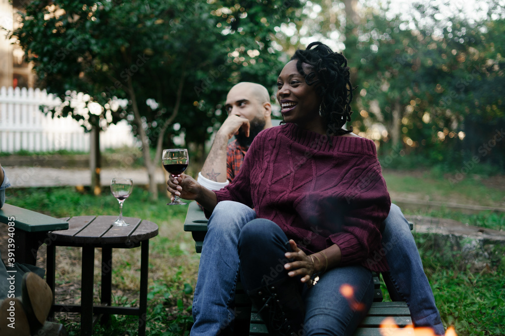 Black friends safely gathered and enjoying a backyard kickback party ...