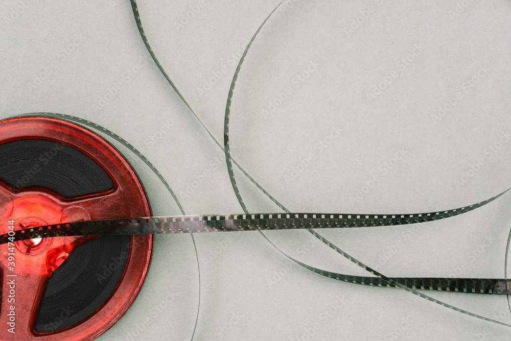 Red old film reel on a green background. 16mm film reel. Filmstrip top ...