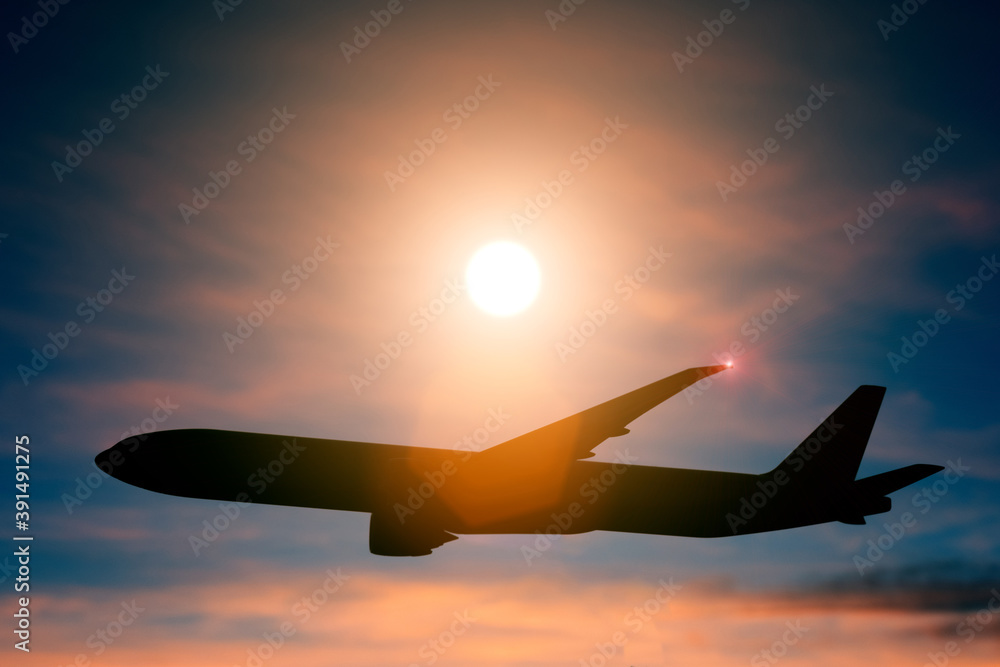 Airplane silhouette with sunset background. Shape of B777 in backlight ...