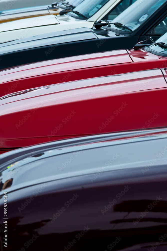 Abstract image showing front end of classic cars lined up Stock Photo ...