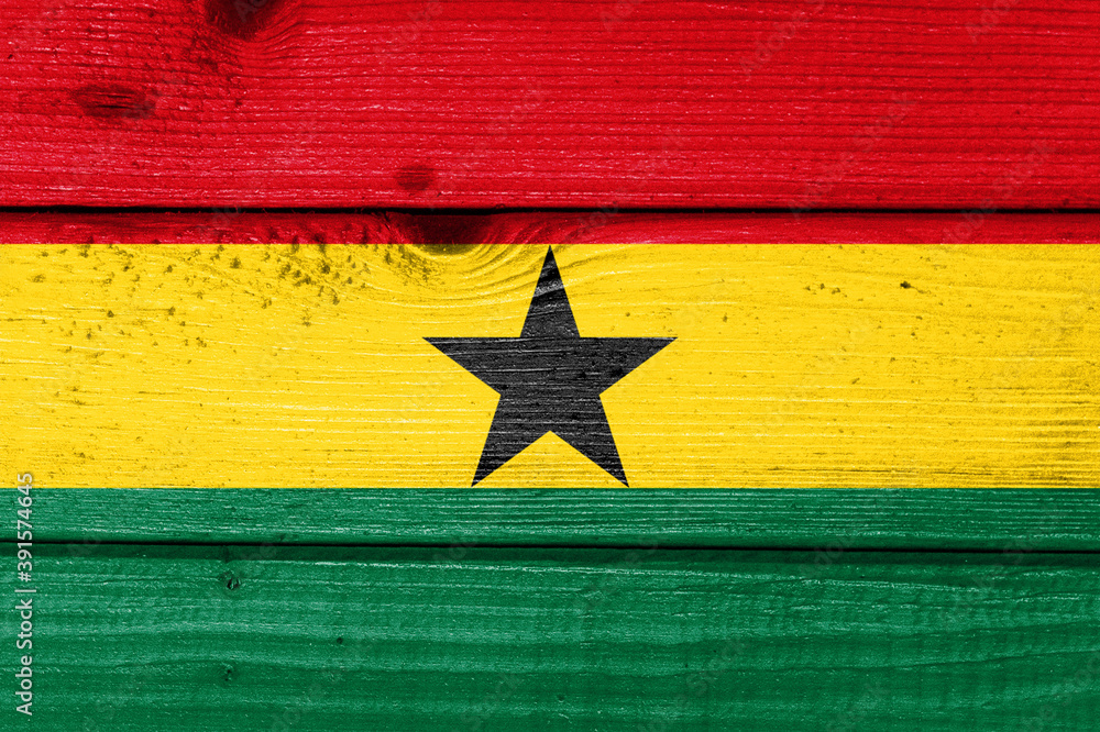 Ghana flag painted on old wood plank background. Brushed natural light ...