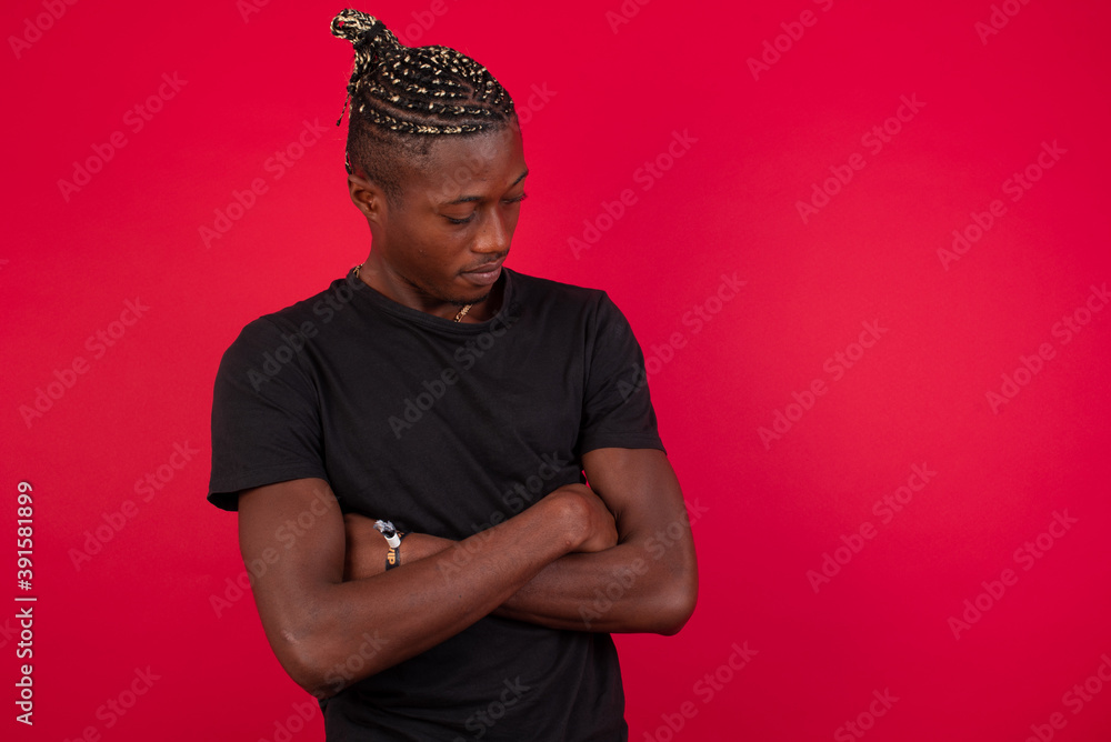 Displeased Young African American handsome man standing against red ...