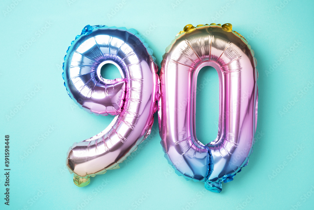 Rainbow foil balloon number, digit ninety. Birthday greeting card with ...