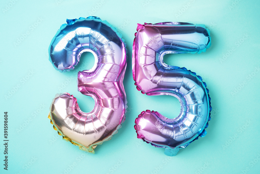 Rainbow foil balloon number, digit thirty-five. Birthday greeting card ...