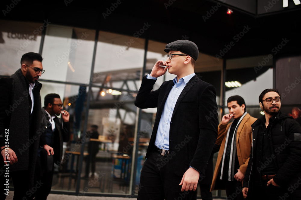 Group of handsome retro well-dressed man gangsters smoking outdoor ...