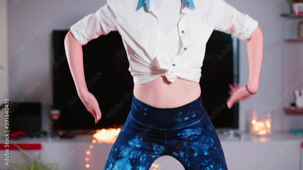 Woman shows the movement of the booty in sports training. The correct ...