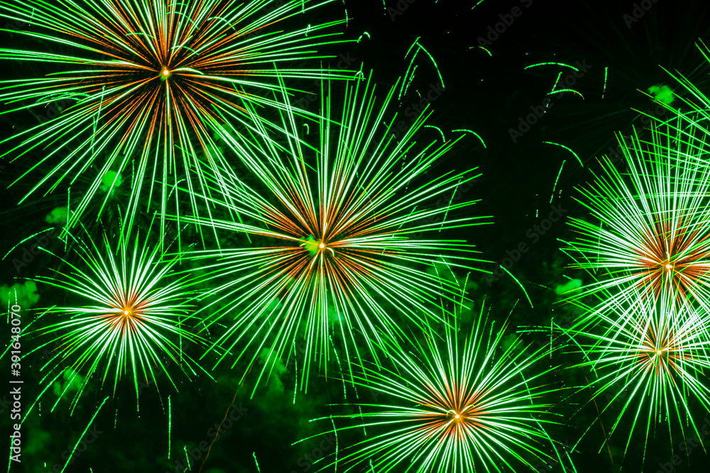 Vivid fireworks with sparks in green colors. Explosive pyrotechnic ...