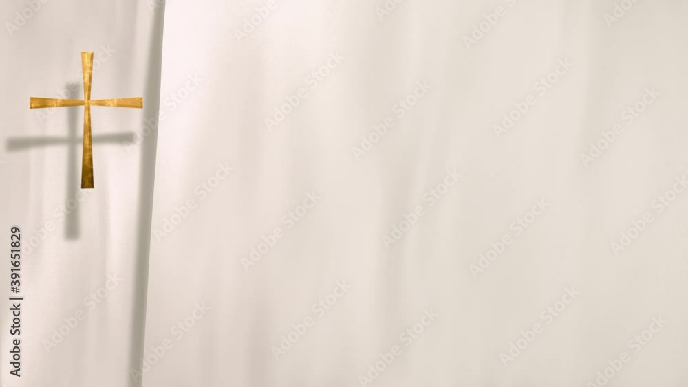 Waving satin with golden Christian Cross on liturgic white copy space ...