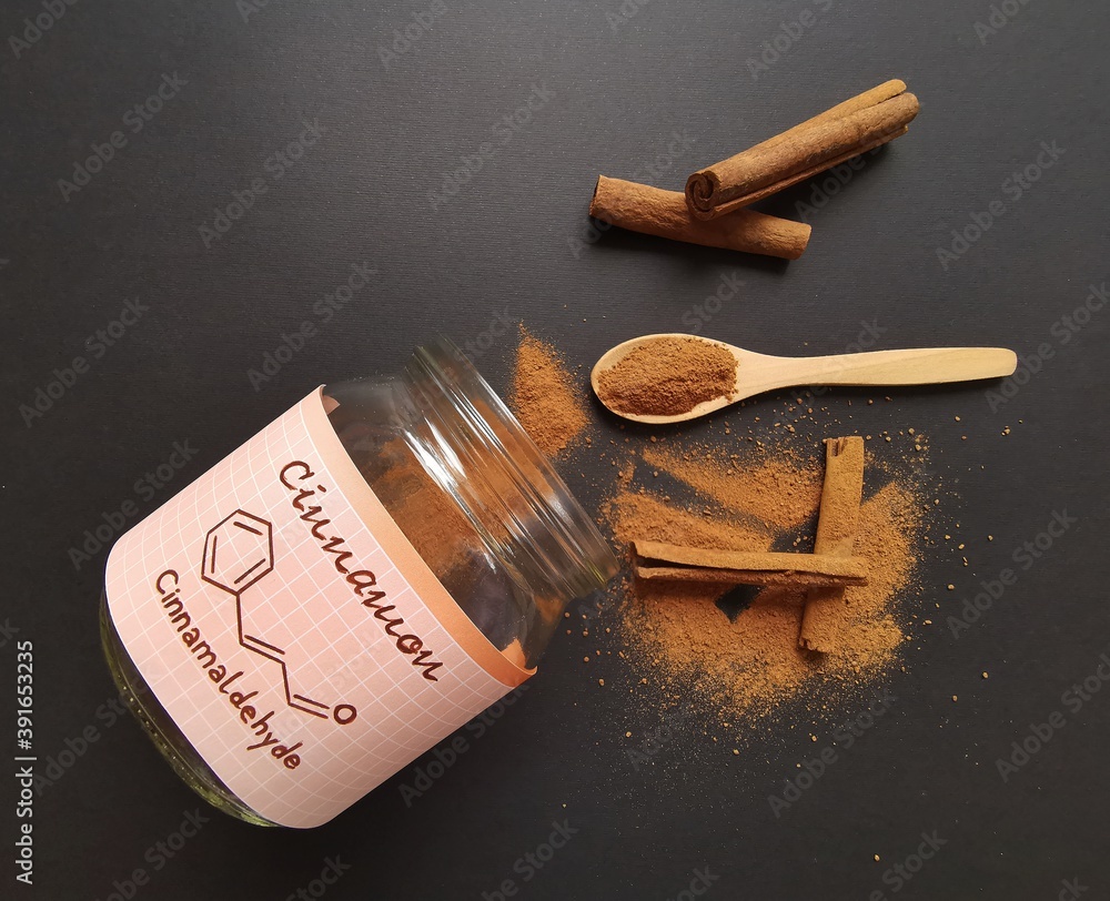 Cinnamon sticks and milled cinnamon spice in the glass jar with ...