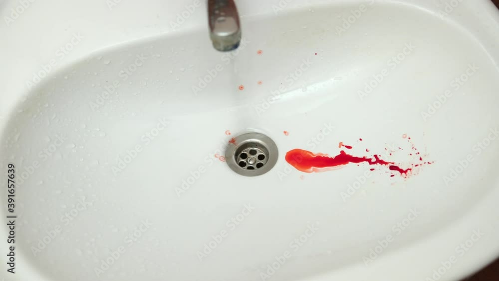 Close-up shot of blood on sink, halloween or crime theme. Bloodshed ...