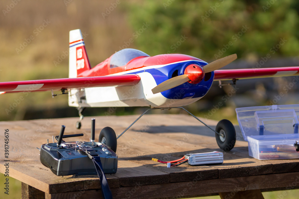 RC plane on a grassy runway Stock Photo | Adobe Stock