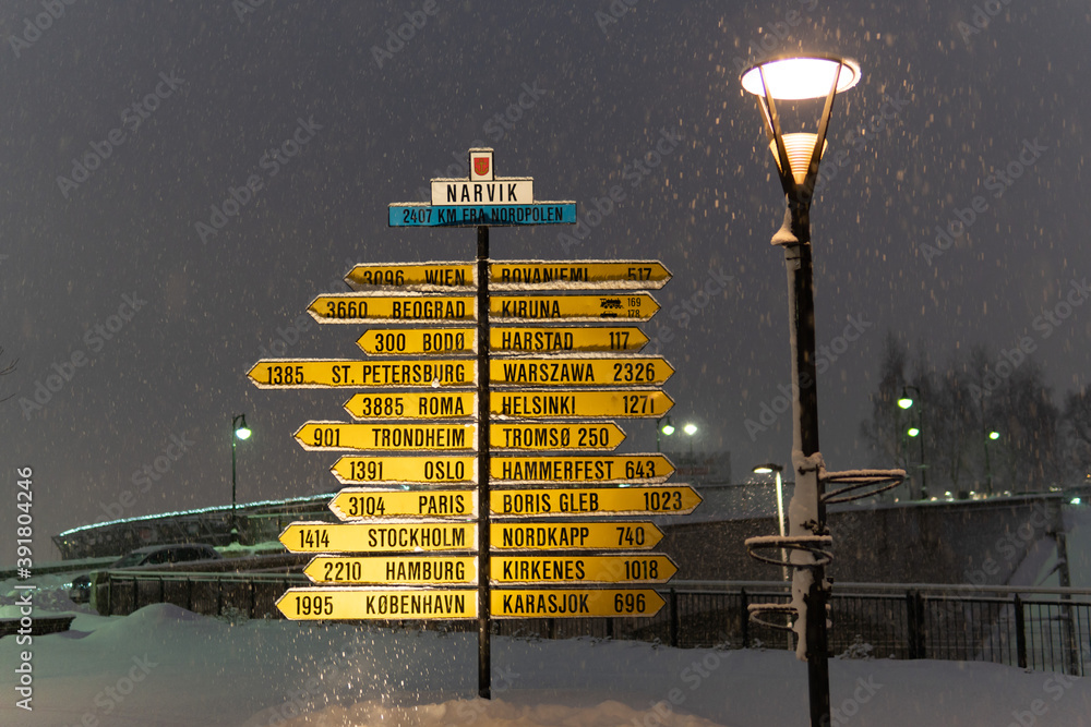 Narvik, Norway - December 4, 2019: The famous yellow sign post in the ...