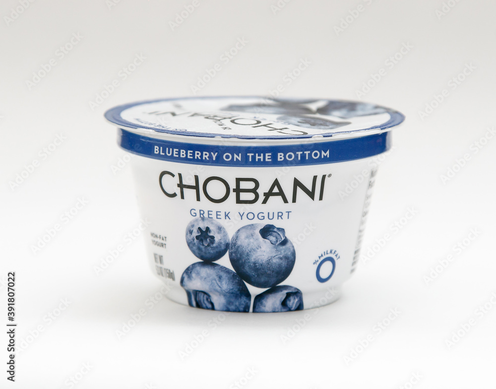 Container of blueberry Chobani Greek yogurt against white background ...