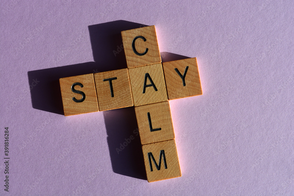 Stay Calm, words in wood alphabet letters on purple background Stock ...