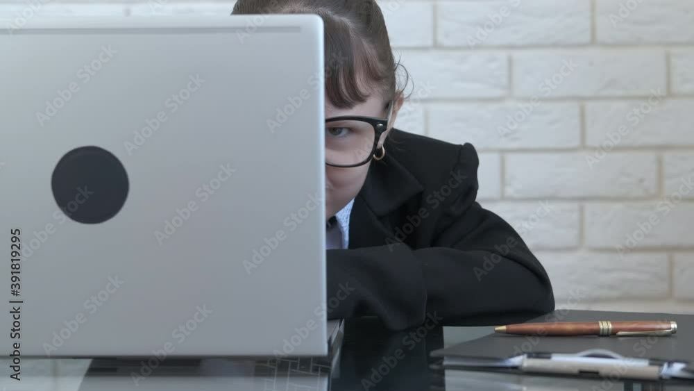 Angry child at the computer. Angry boss. Business little girl with ...