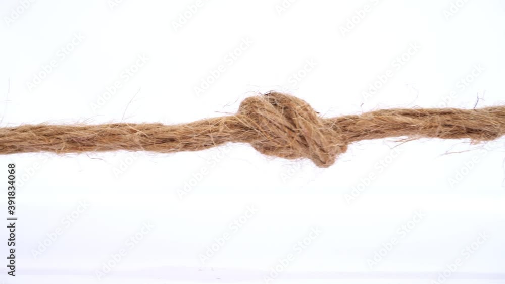 Rope - Pull the knot isolated on white background Stock Video | Adobe Stock