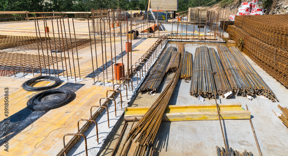 Bundles of steel rebar rods and grids into reinforced cement concrete ...