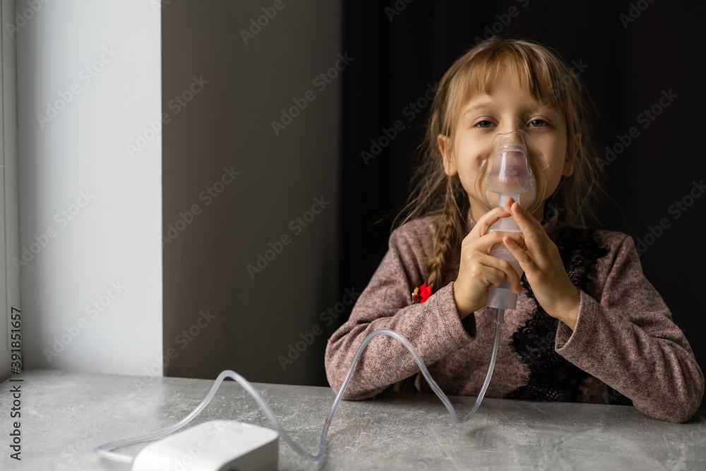 Little girl making inhalation with nebulizer at home. child asthma ...
