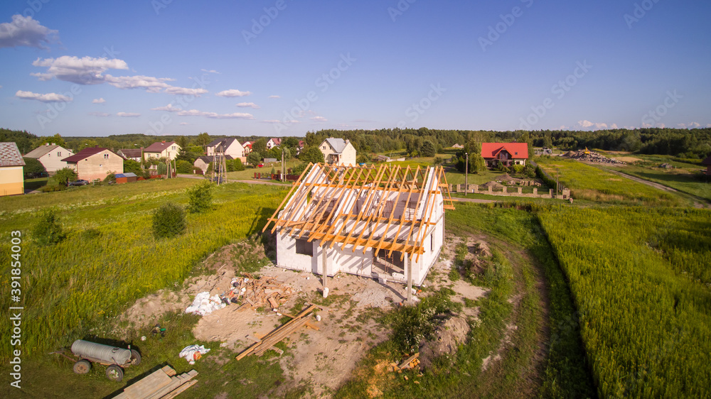Aerial view on detached house under construction. House in basic state ...