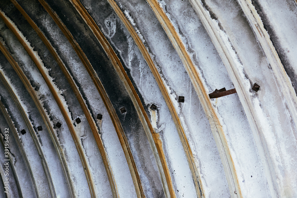 Embossed stone ribs in an abandoned concrete military hangar, vintage ...