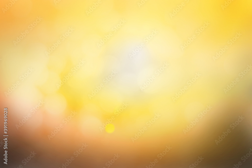 Hope concept; Abstract blurred sunrise background blurring warm colors ...
