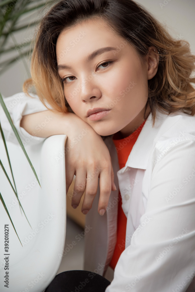 Portrait Fashion Asian Girl With Wavy Hair Highlighted Wearing White