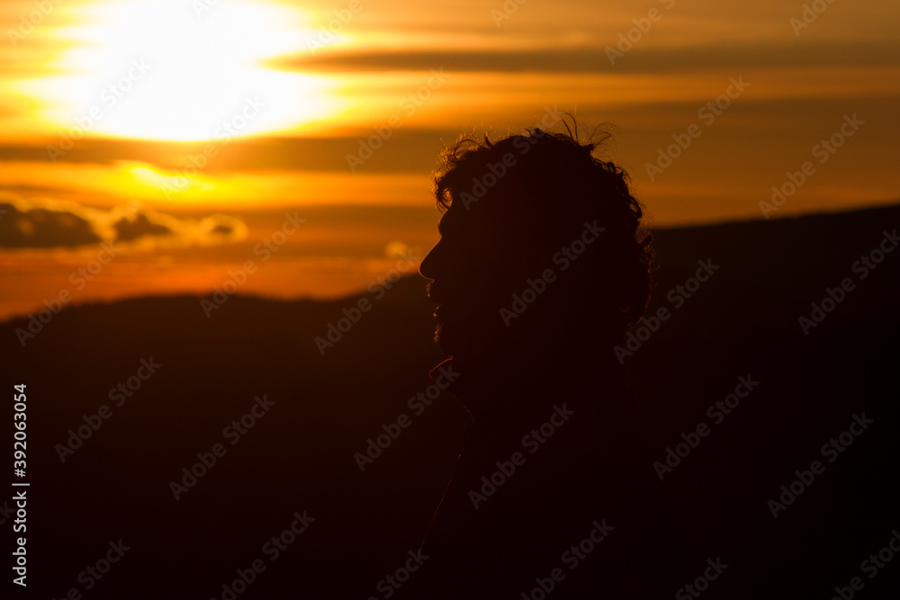 Silhouette of a man's head at sunset Stock Photo | Adobe Stock