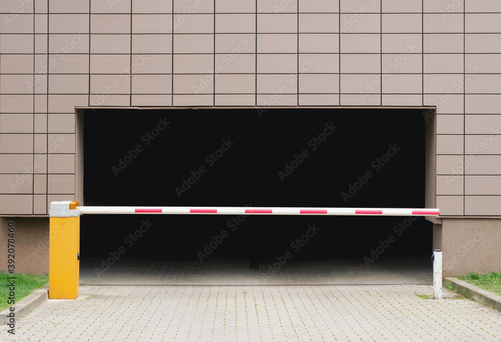 Parking entrance with car park barrier and automatic car entry system ...