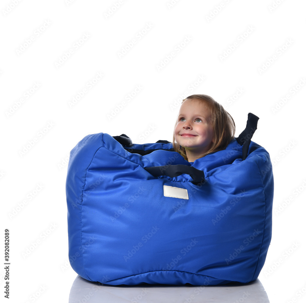 little girl sits with a soft toy in a unique spherical cocoon for ...