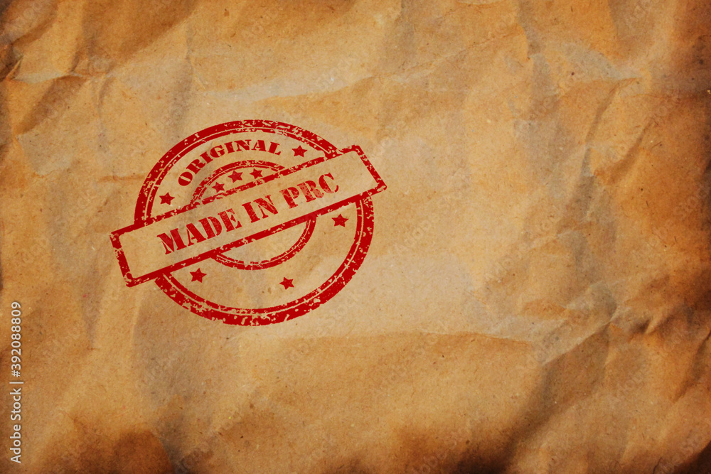 Made in PRC stamp printed on crumpled sheet of burnt paper. PRC Product ...