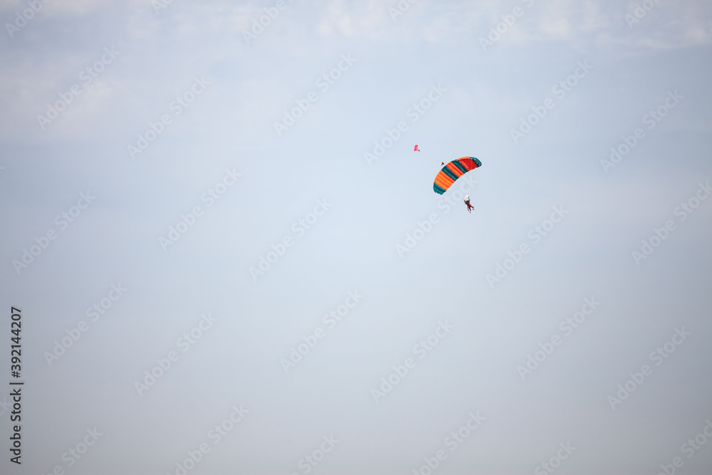 orange and Green parachute, made for two persons, a beginner and an ...