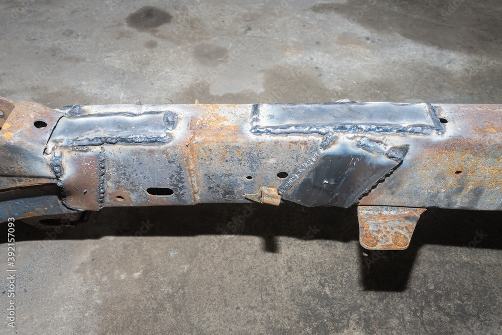 Repairing Car Chassis by Electrode Arc Welding in Car Repair Shop in ...