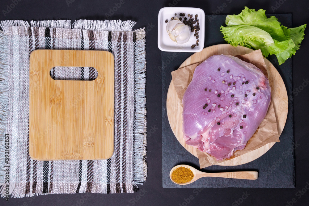 raw Turkey fillet top view on black background. the view from the top ...