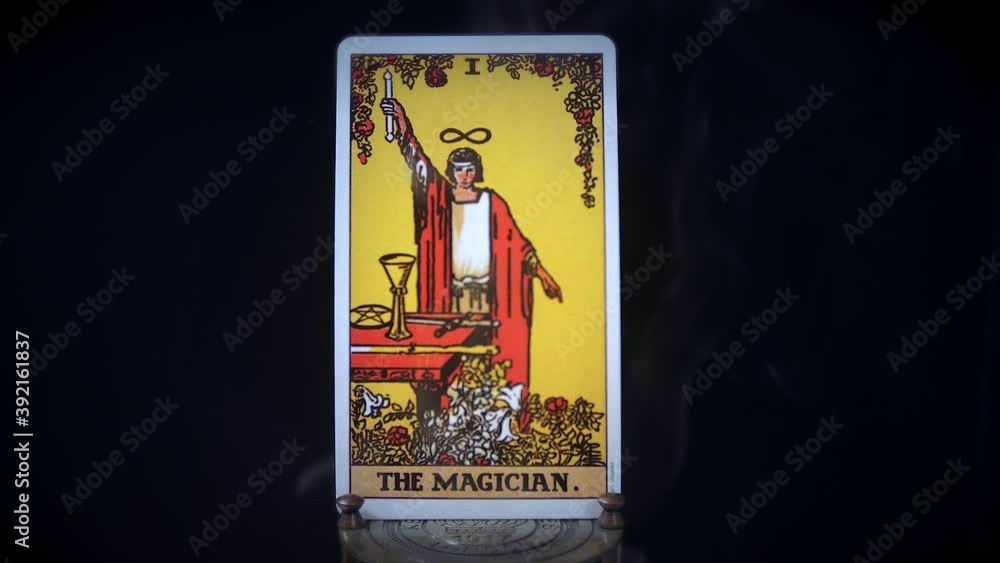 Video Stock A tarot Magician card sits on a brass stand as smoke rises ...
