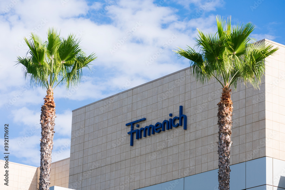 Firmenich sign logo on office facade. Firmenich SA is a private Swiss ...