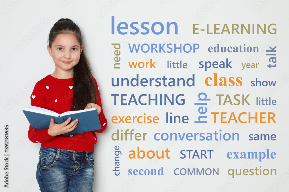Cute little girl reading vocabulary on white background with word cloud ...
